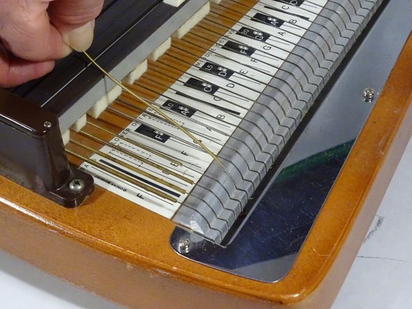 Replacing an autoharp string (Type B) - iFixit