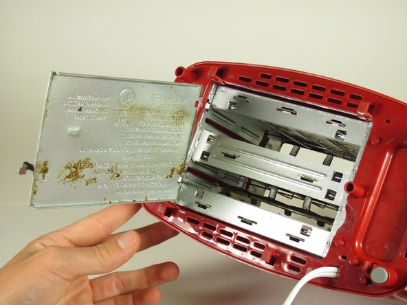 How to empty and clean Rival 16131 Toaster crumb tray - iFixit