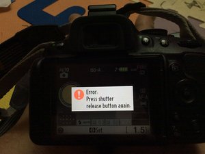Press shutter release button again - Nikon D5100 - iFixit
