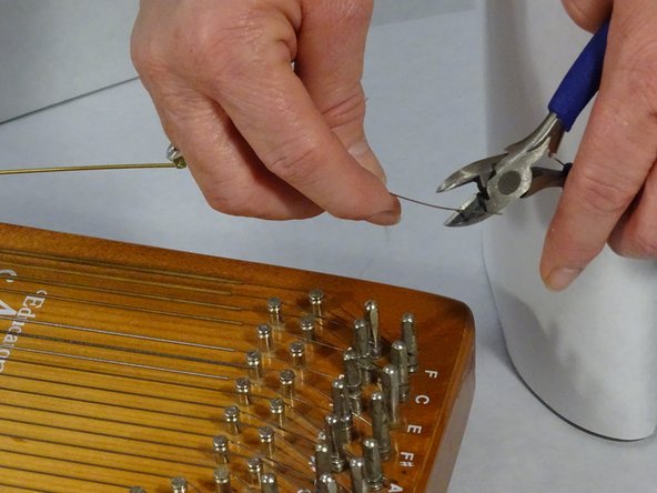 Replacing an autoharp string (Type B) - iFixit